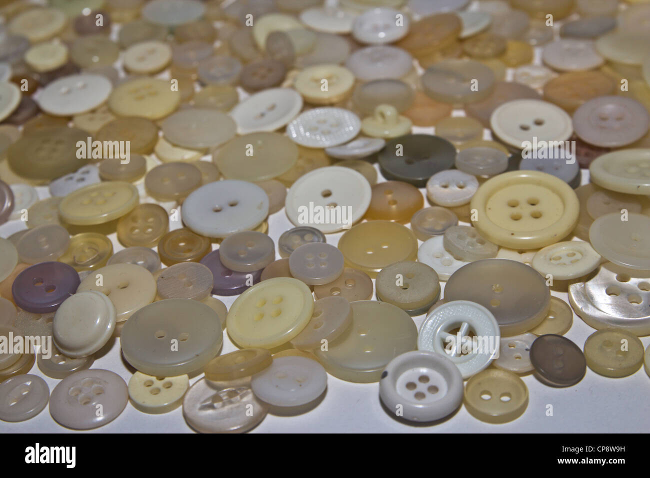 light color sewing buttons Stock Photo - Alamy
