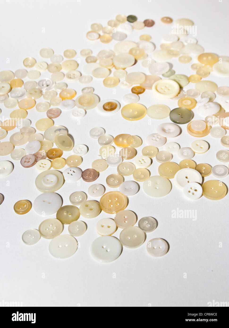 light color sewing buttons Stock Photo - Alamy