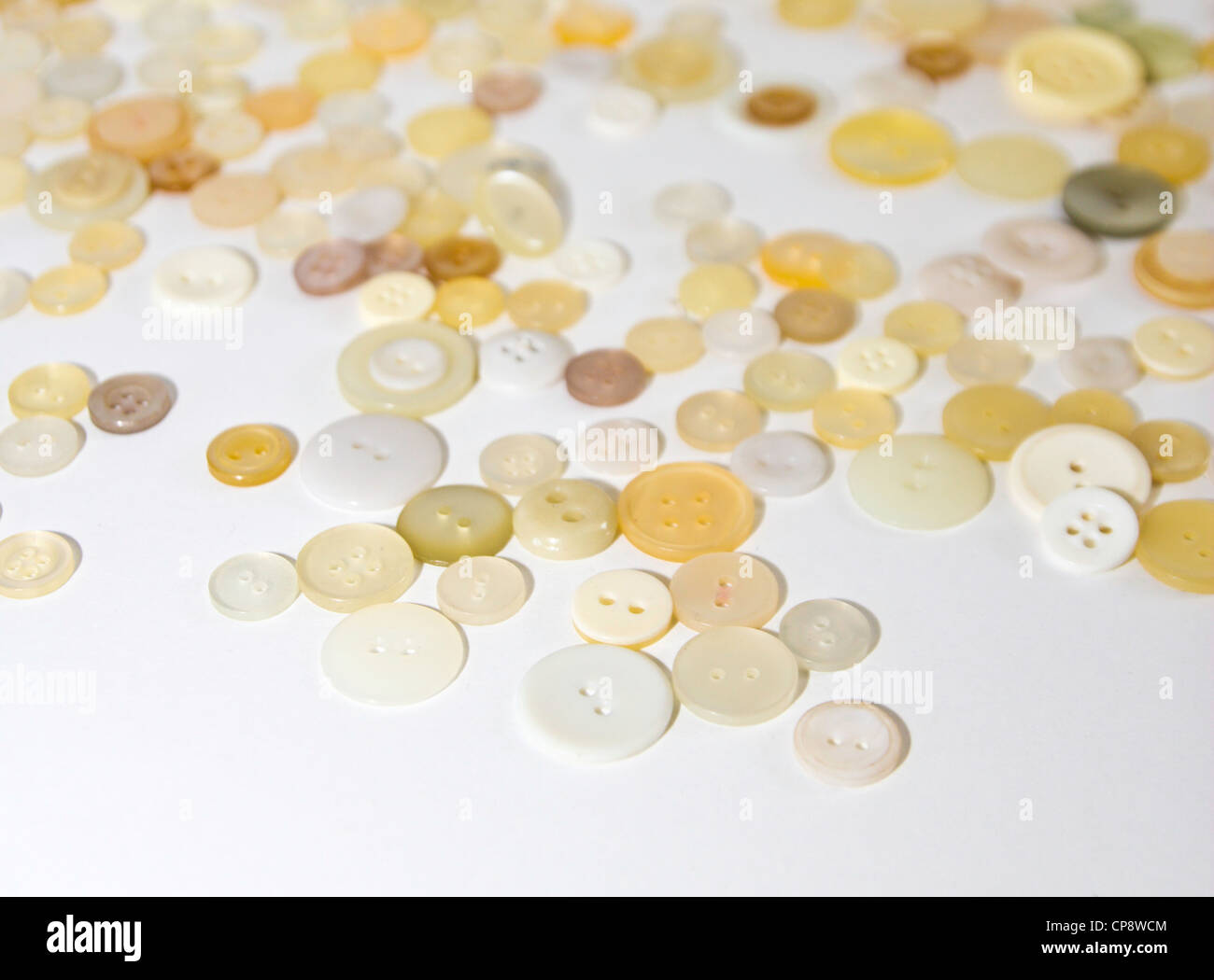 light color sewing buttons Stock Photo - Alamy