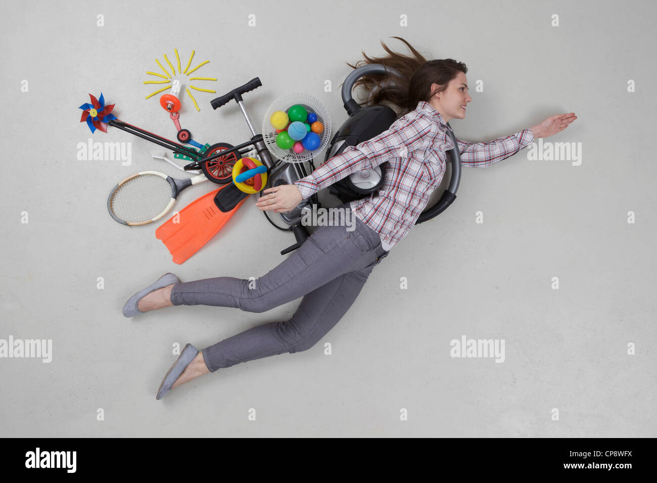 Mid adult woman flying, smiling Stock Photo - Alamy
