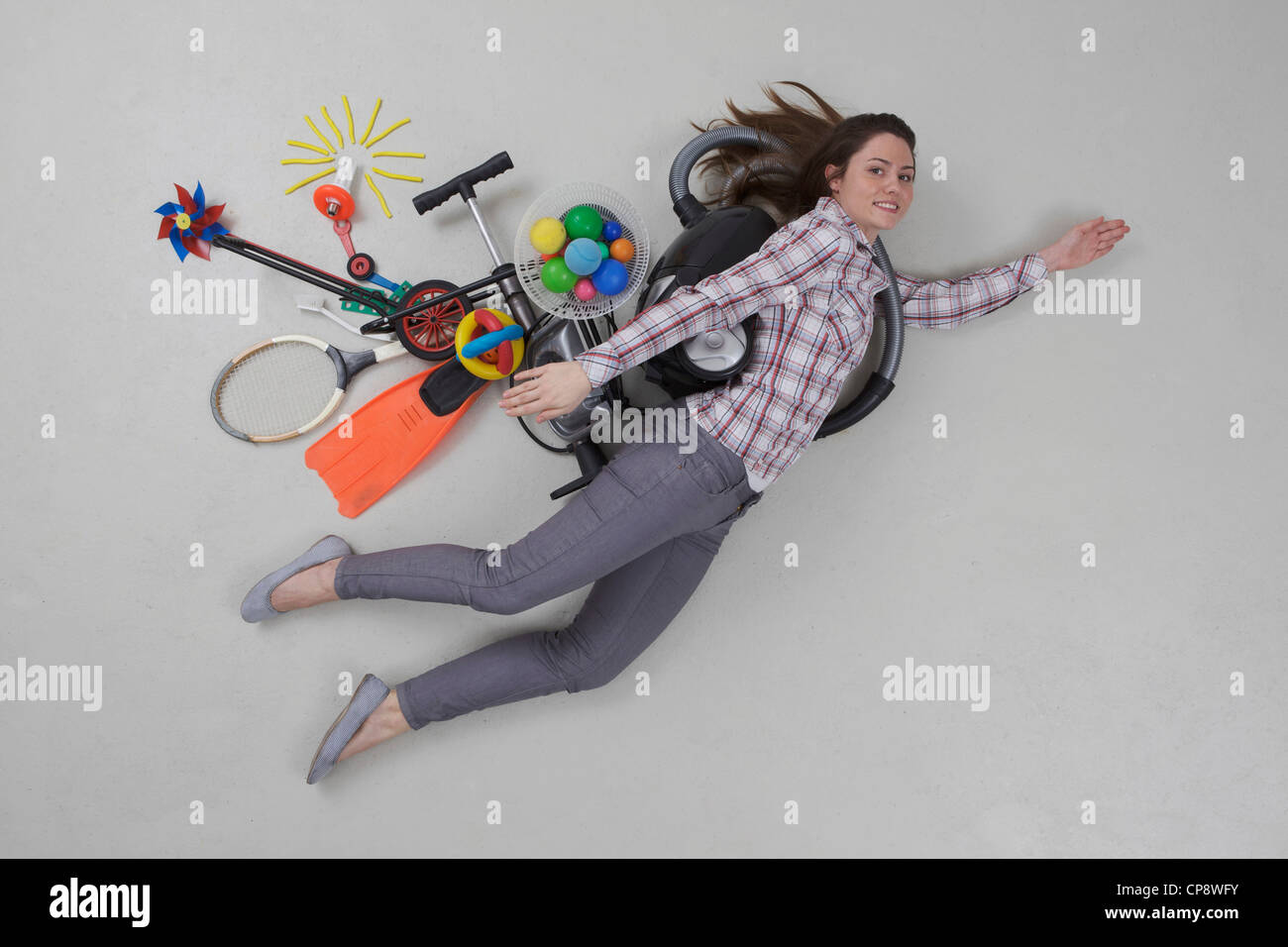 Mid adult woman flying, smiling, portrait Stock Photo - Alamy