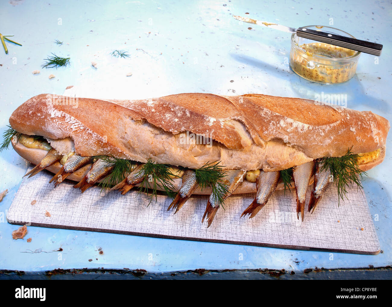 Greece, Baguette with fish on chopping board Stock Photo - Alamy