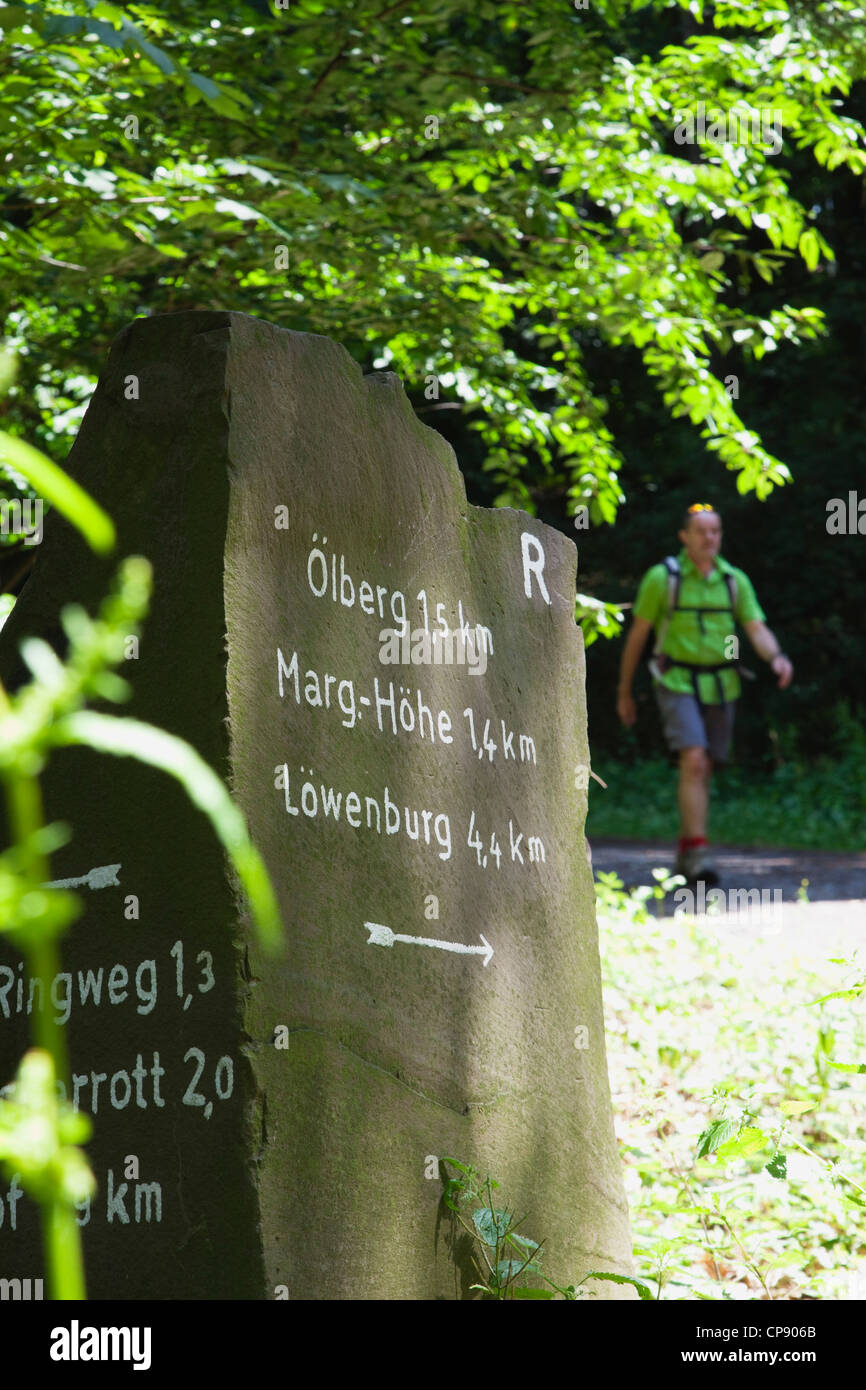 Europe, Germany, North Rhine Westphalia, Hiking trail sign with hiker ...
