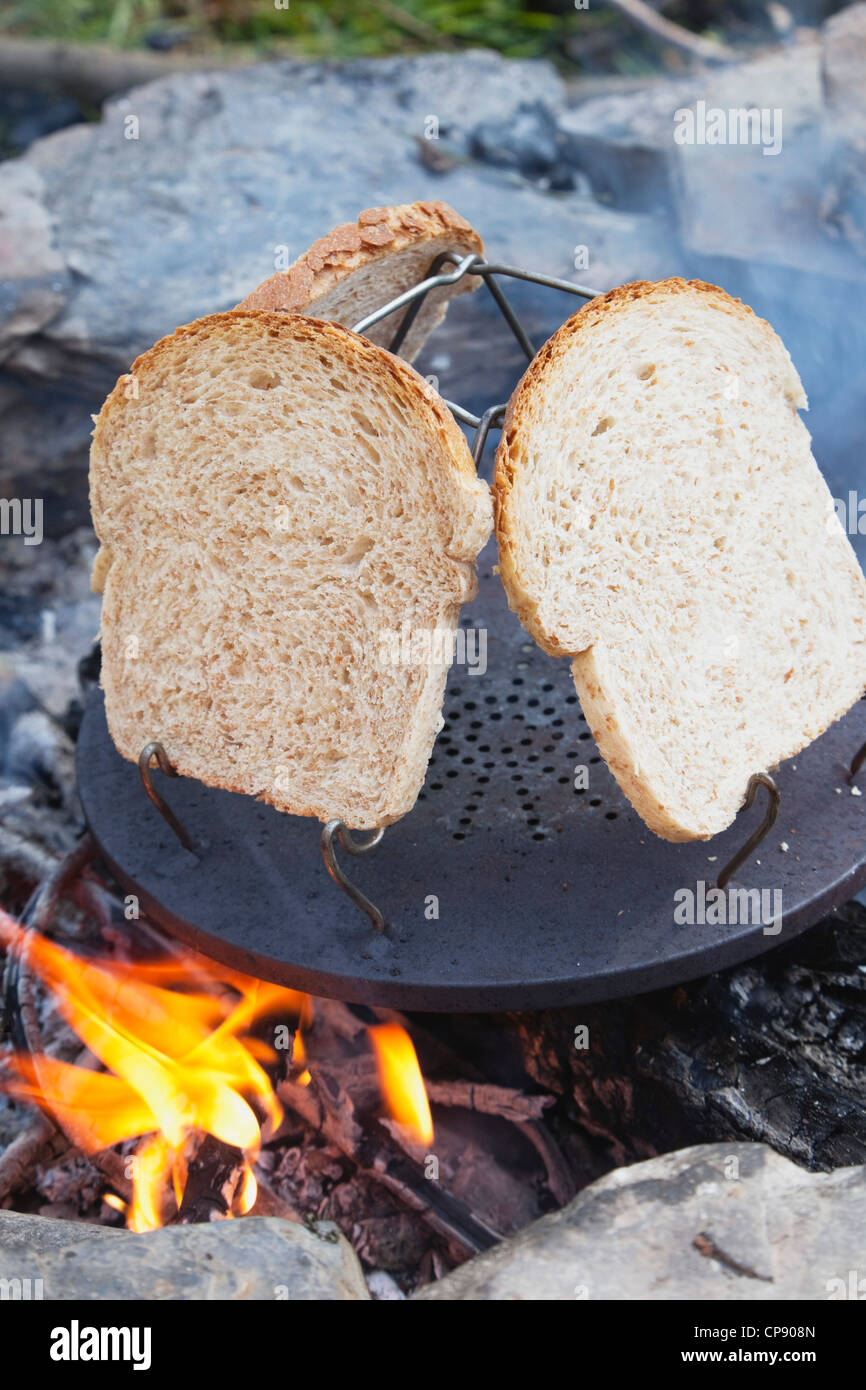 Europe, Belgium, Wholewheat bread toast on campfire Stock Photo - Alamy