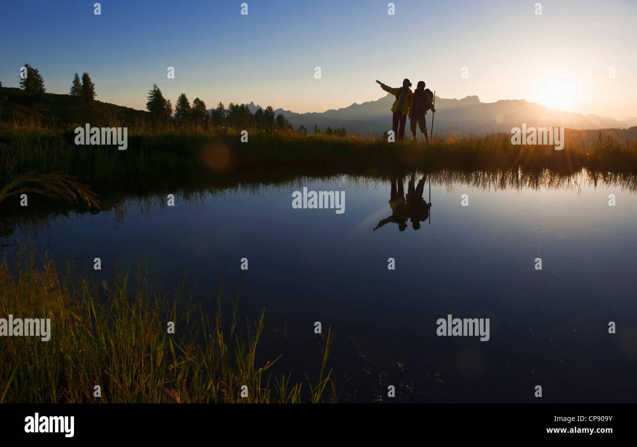 Two men watching sunrise hi-res stock photography and images - Alamy