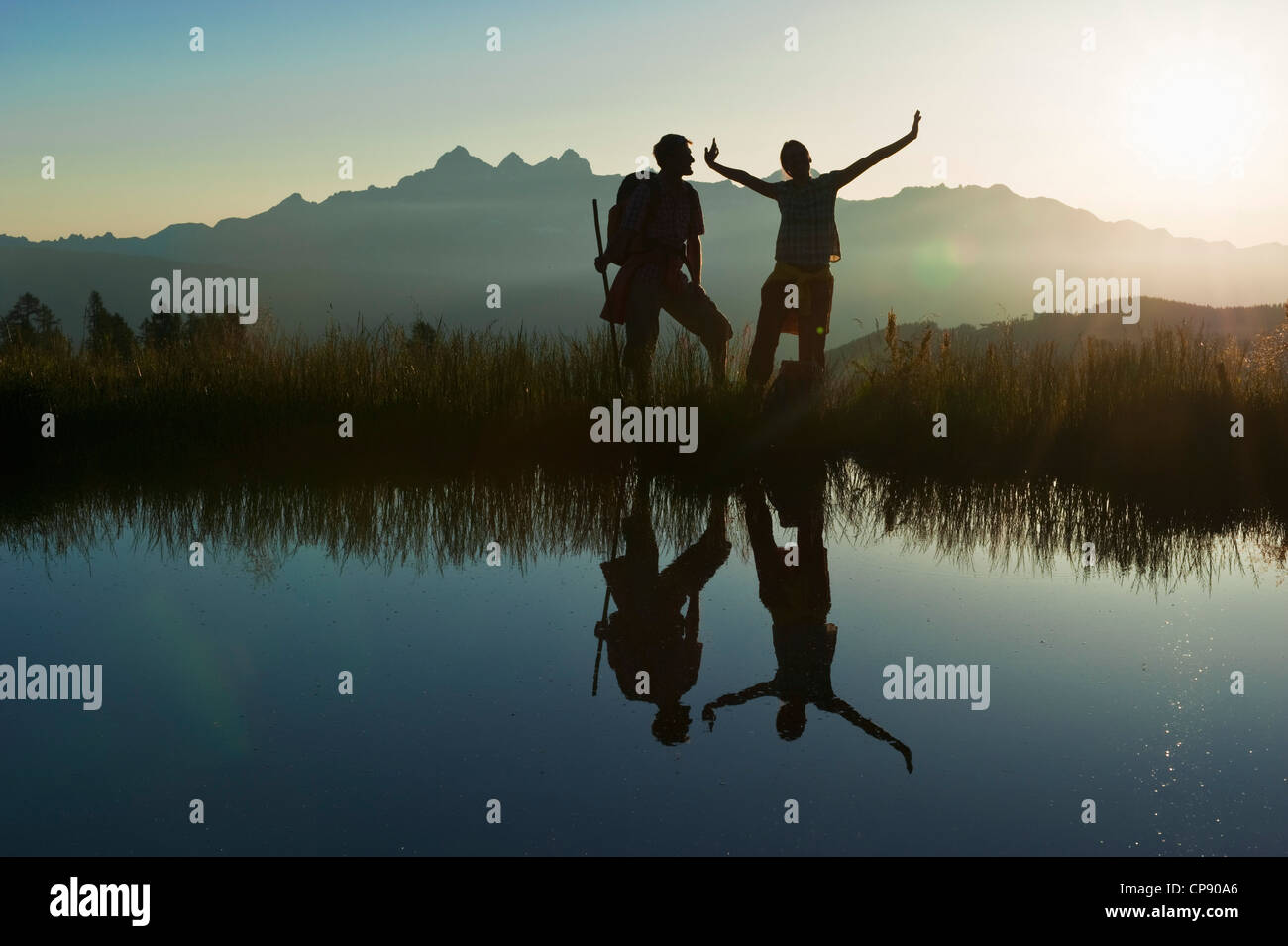 Austria, Salzburg, Couple having fun at alpine lake Stock Photo - Alamy
