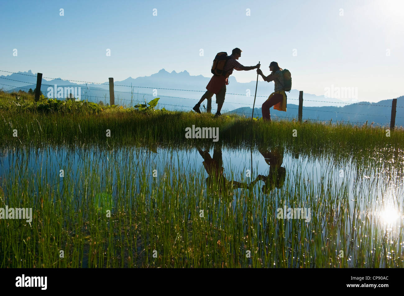 Austria, Salzburg, Couple having fun at alpine lake Stock Photo - Alamy