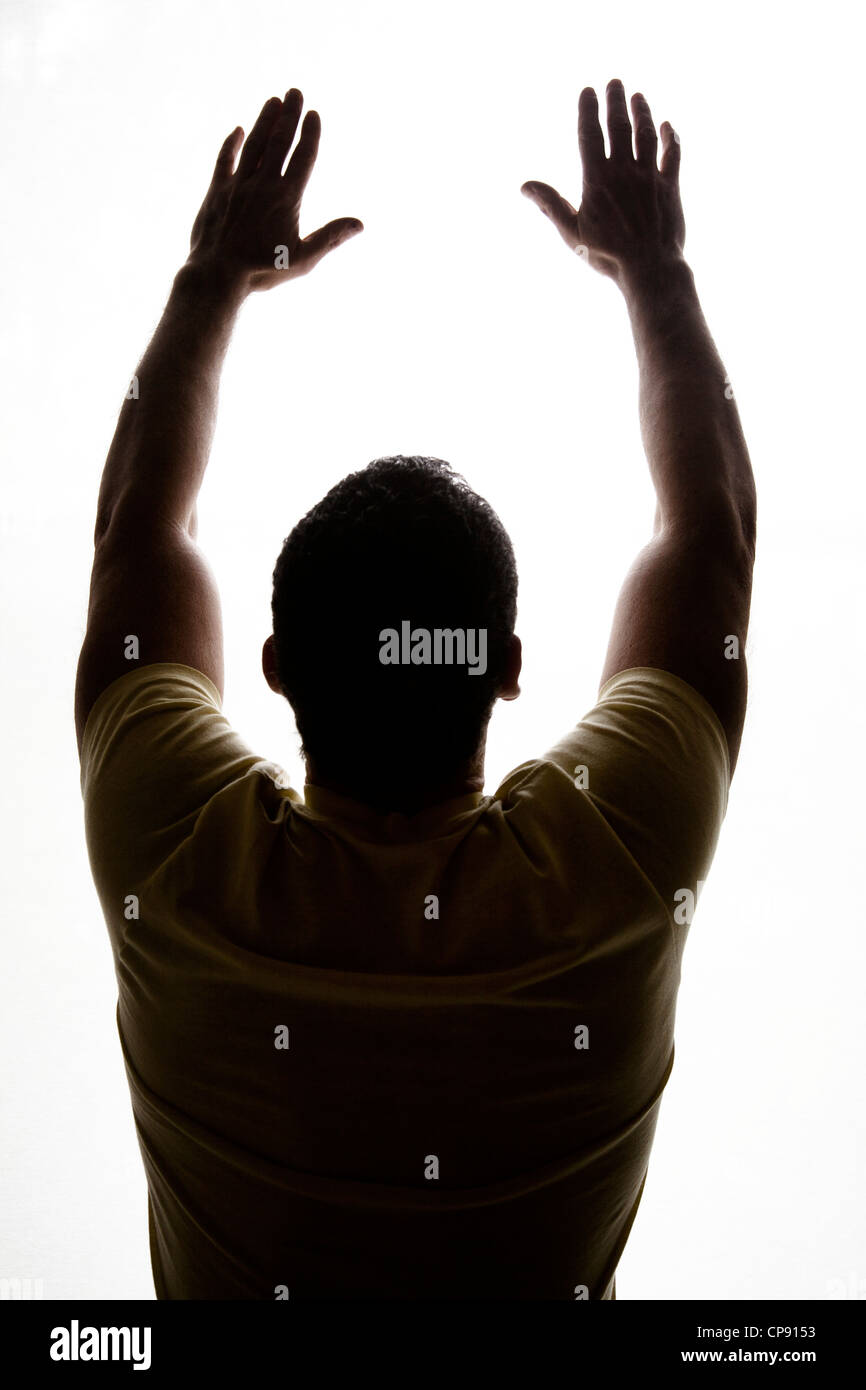 Man's silhouette 'reaching' in front of window Stock Photo - Alamy