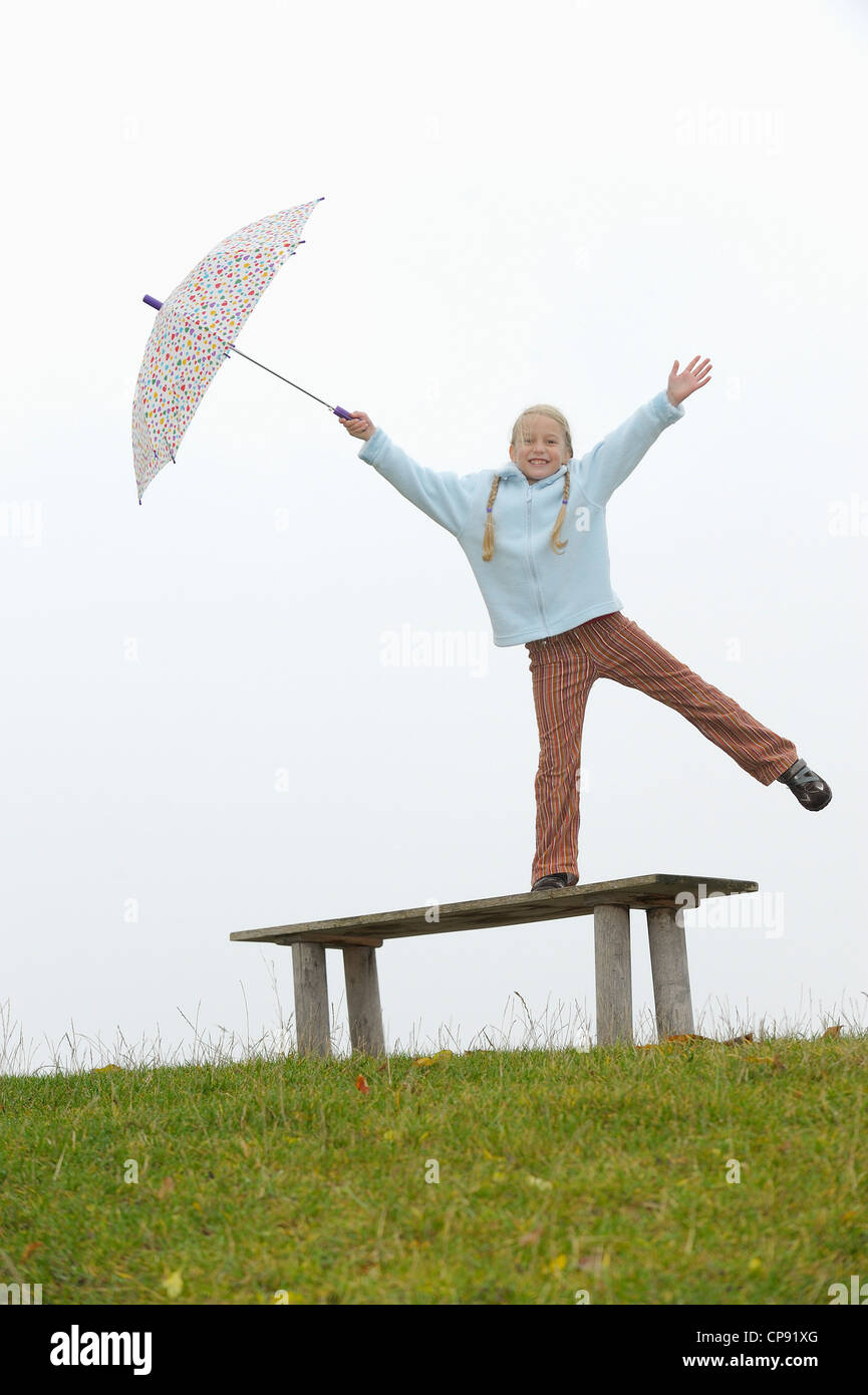 Child wind umbrella hi-res stock photography and images - Alamy