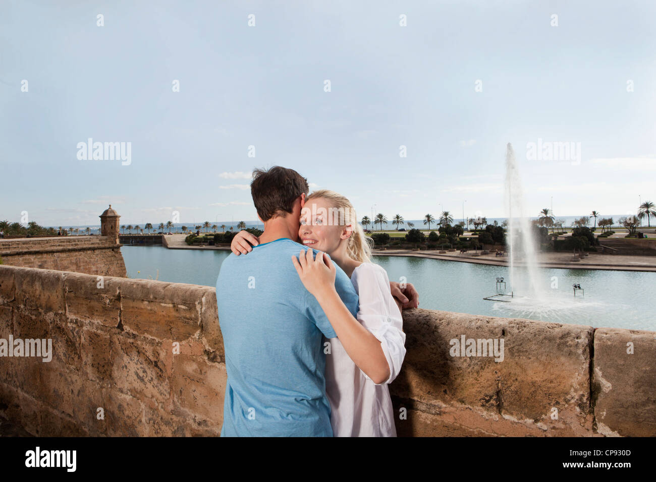 Spain, Mallorca, Palma, Couple hugging at harbour, smiling Stock Photo ...