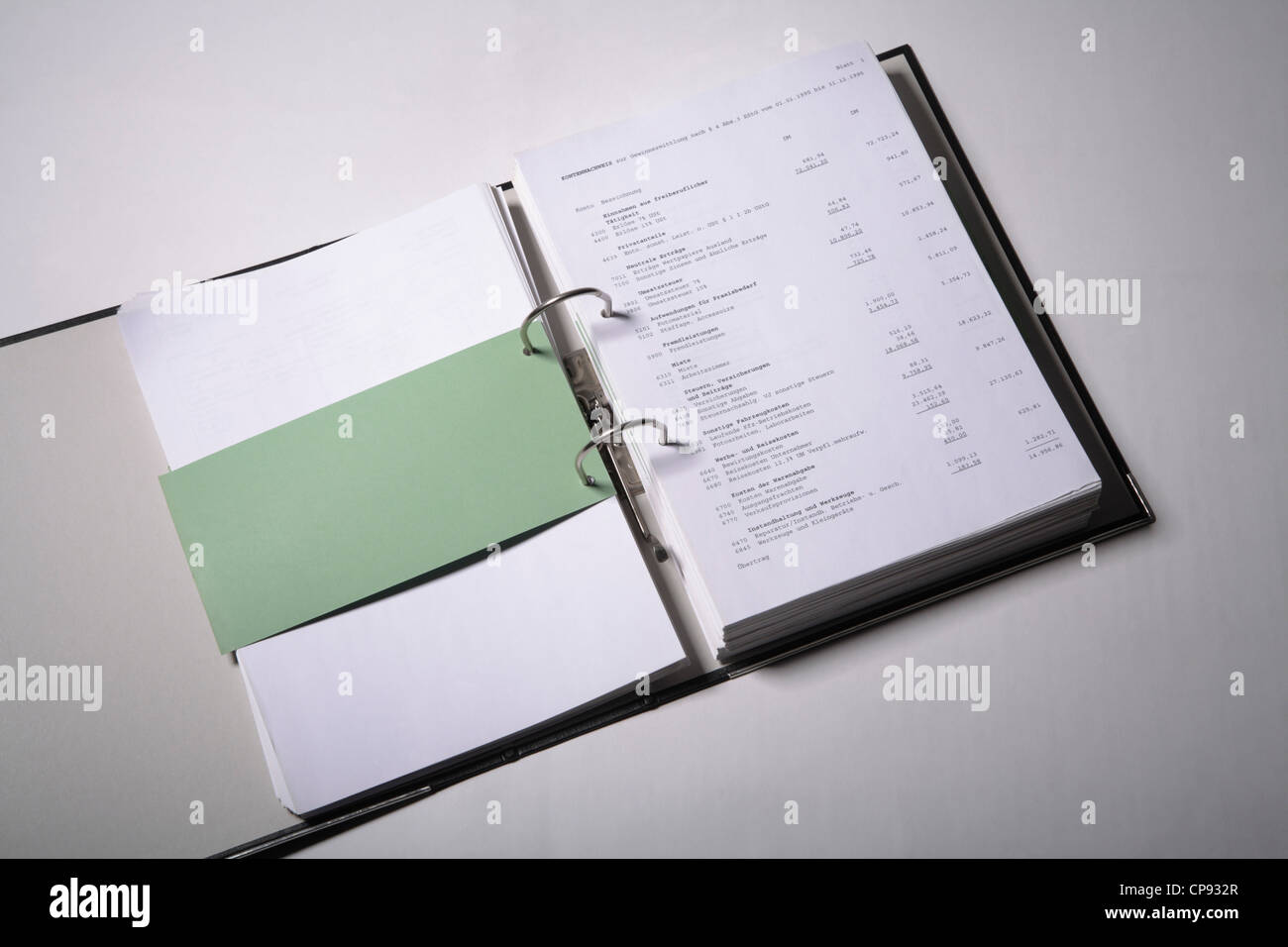 Open accounting file on white background Stock Photo - Alamy