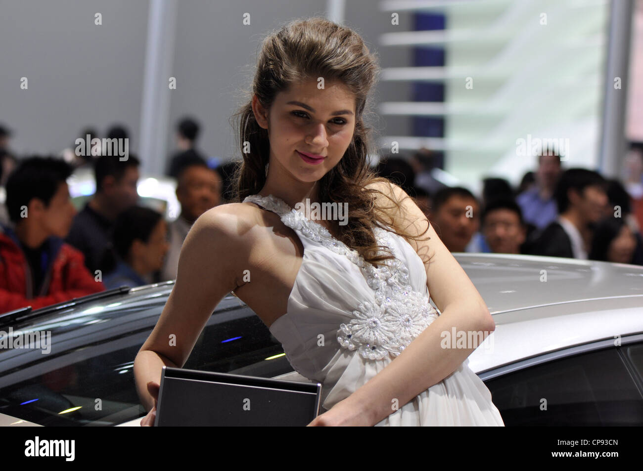 BEIJING - APRIL 29: A foreign model lean on a new car to show a new ...