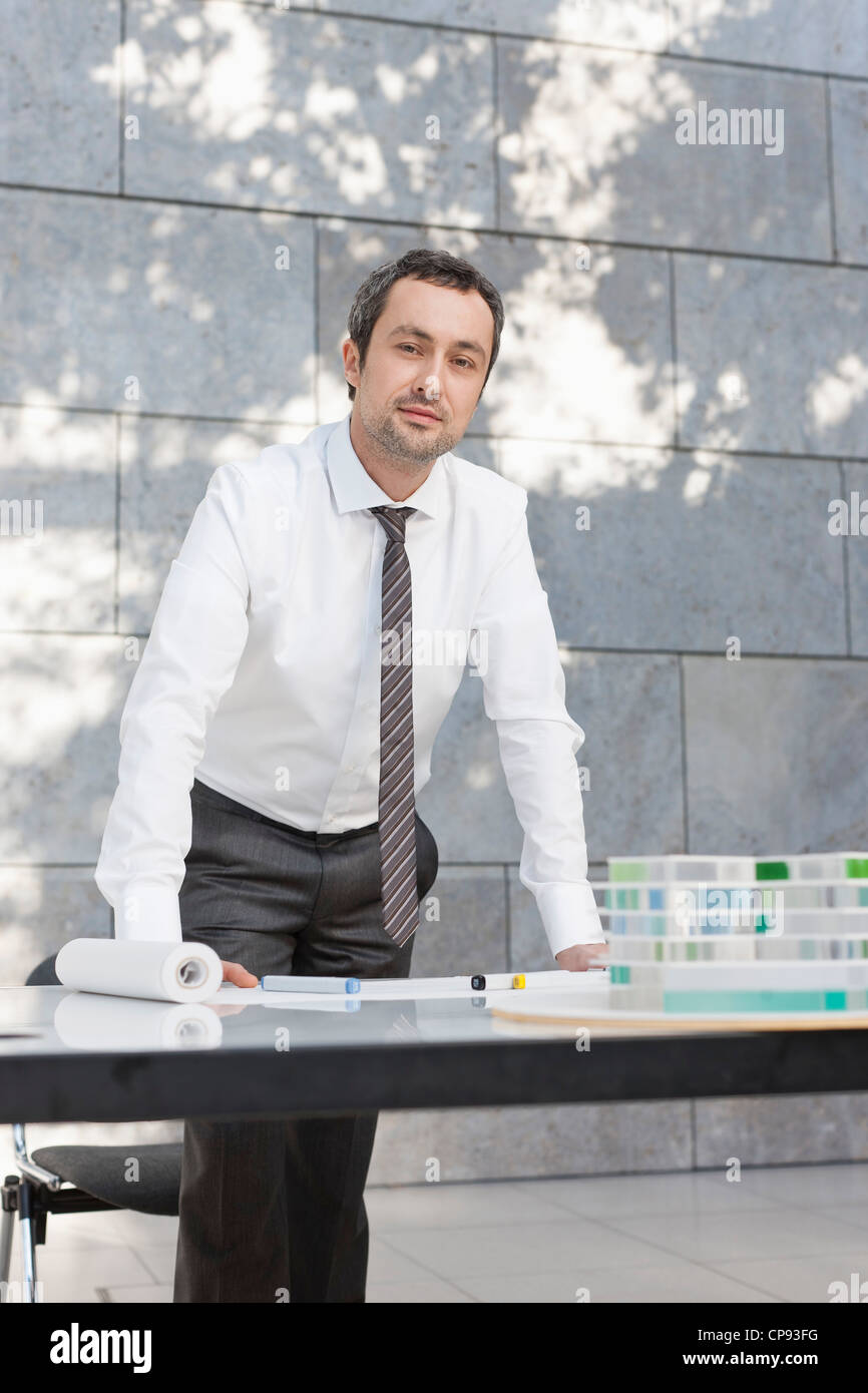 Germany, Leipzig, Businessman with architectural model, portrait Stock ...