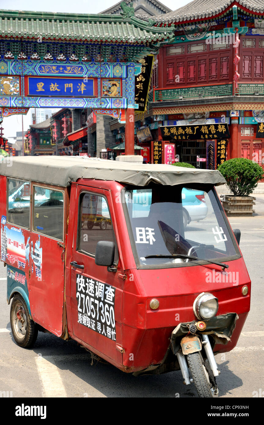 Motor tricycle taxi and Gate to Ancient Culture Street from Shuige ...