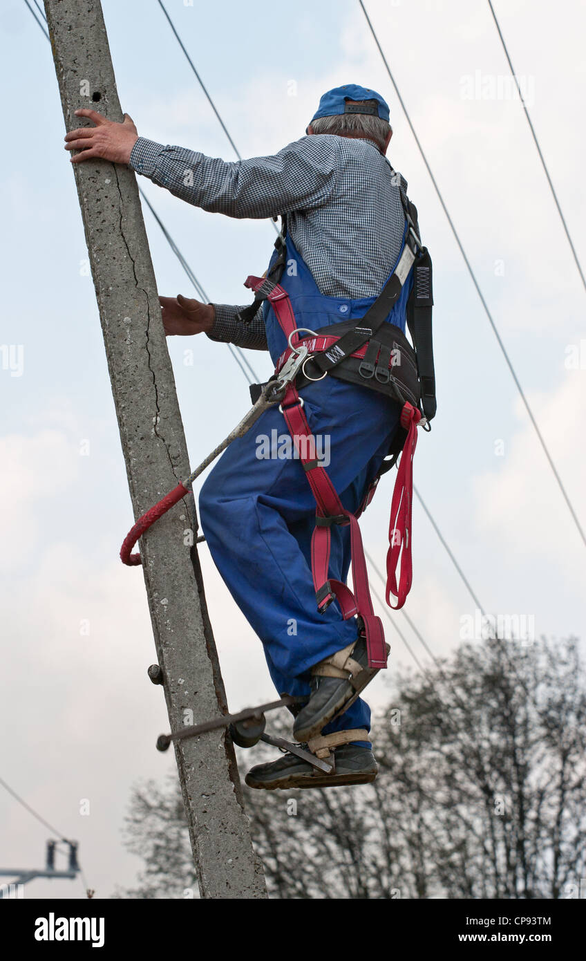 electrician on the pylon Stock Photo - Alamy
