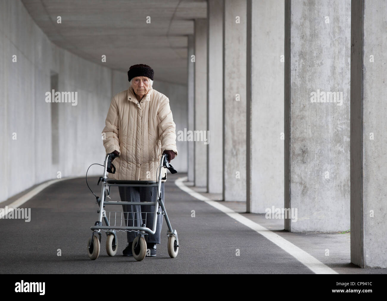 Senior woman with wheeled walker at subway hi-res stock photography and ...