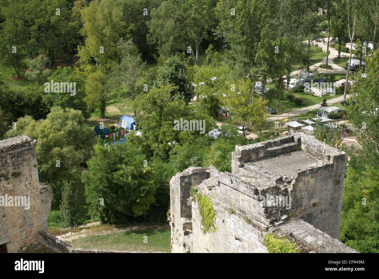 The ruins of a castle tower over a pretty campground in the Bordeaux ...