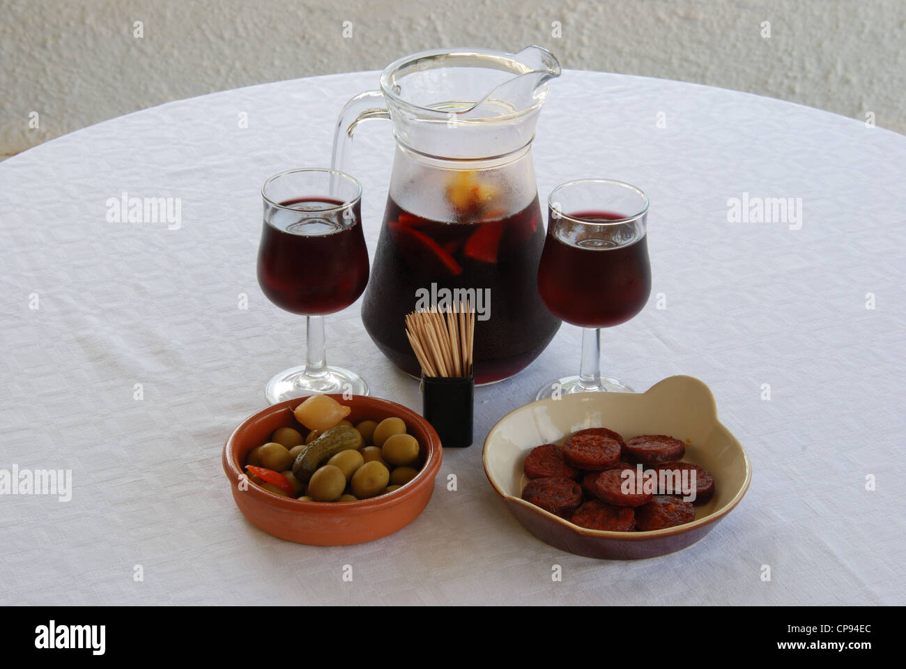 A selection of tapas with a jug of Sangria, Sliced Chorizo sausage and ...