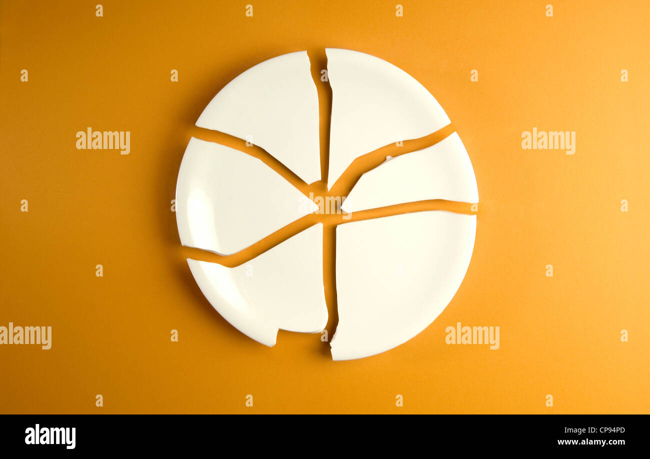 Broken white plate Stock Photo - Alamy