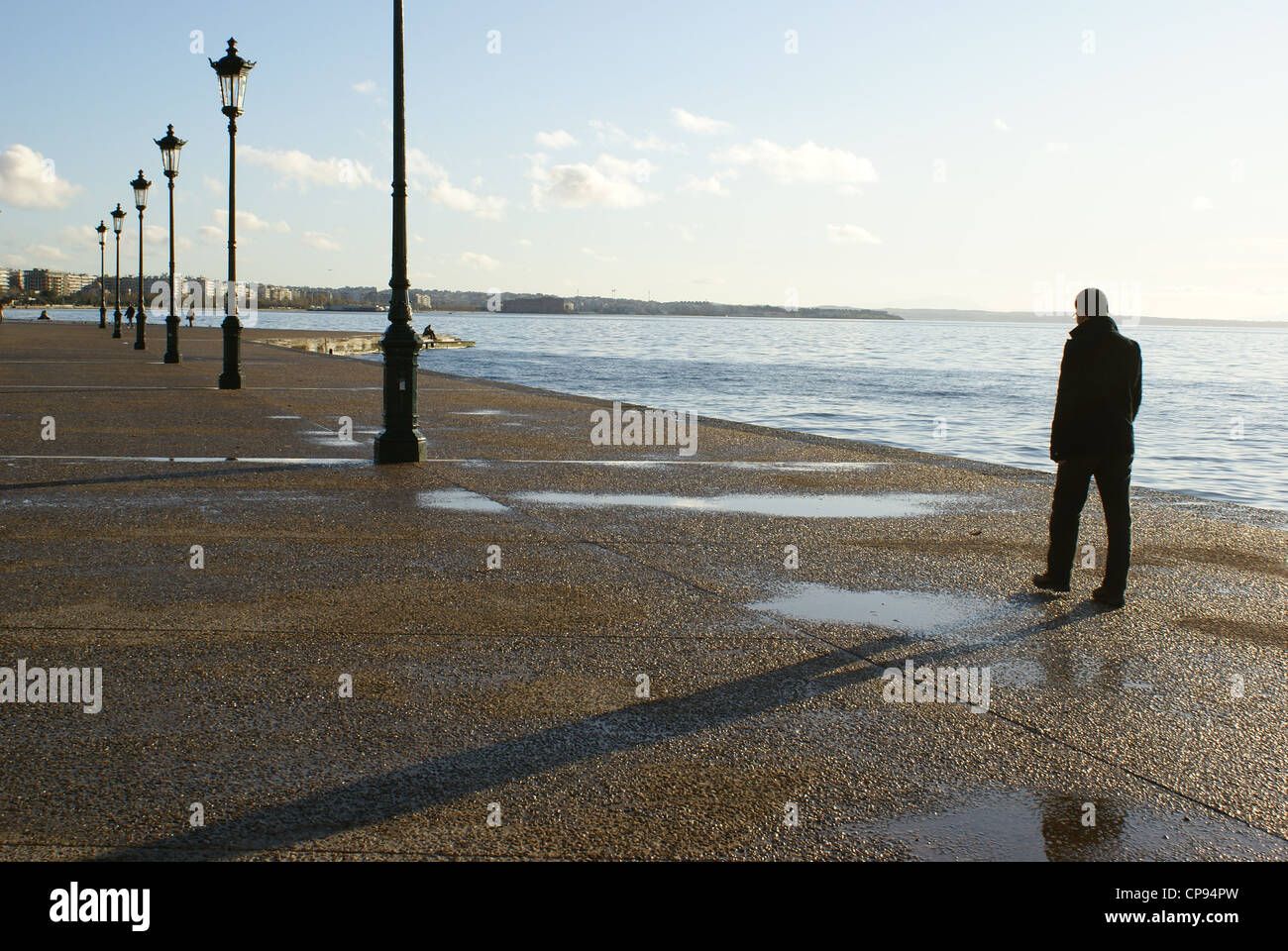 Man walking alone, Thessaloniki, Greece Stock Photo - Alamy