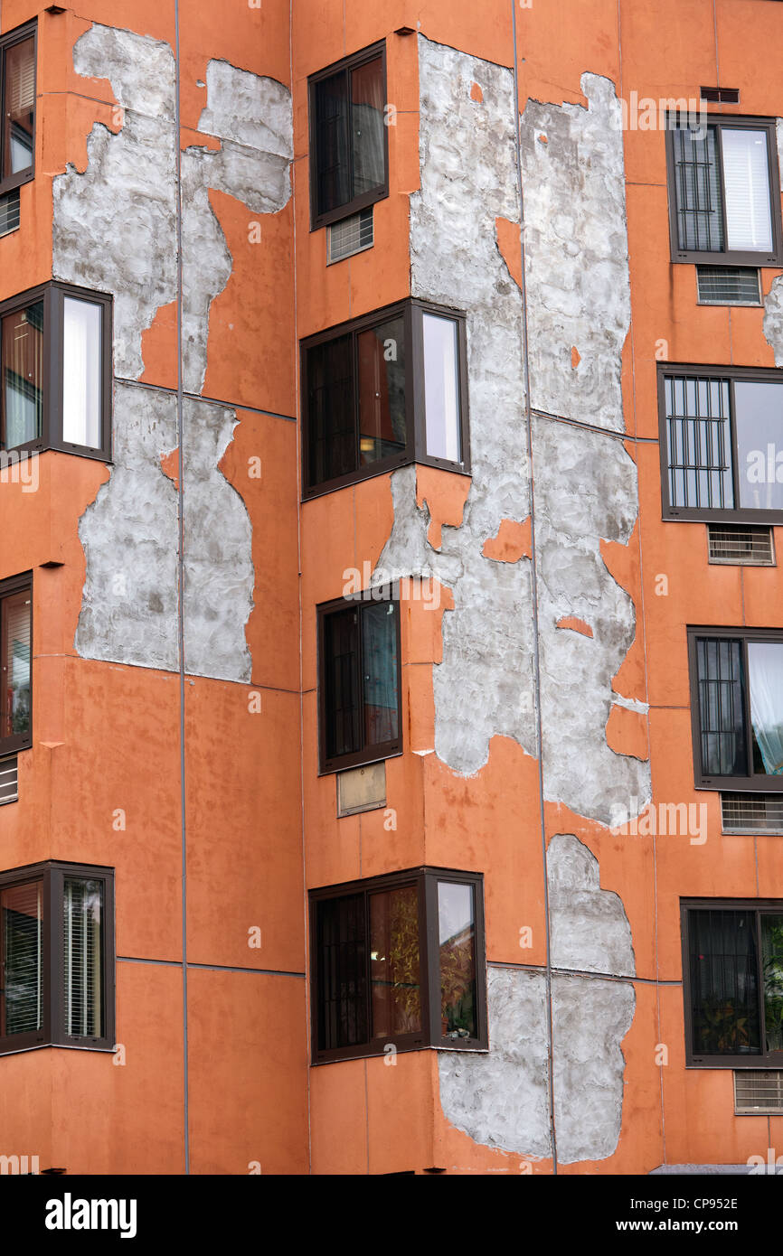 Peeling paint and a damaged facade on an apartment building in the New ...