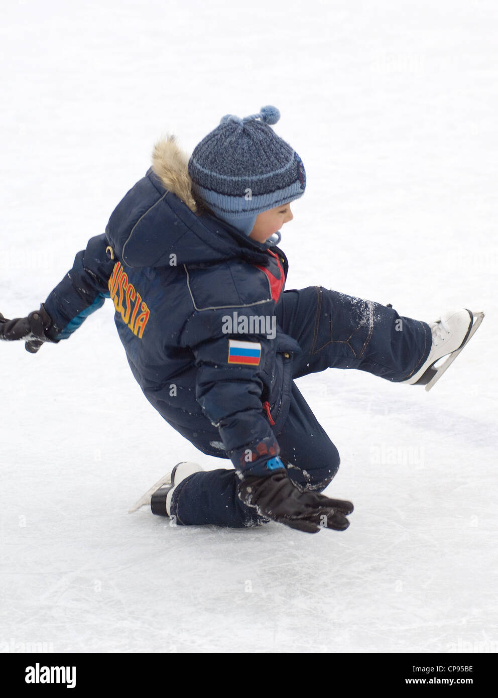 Little kid fell down and getts up Stock Photo - Alamy