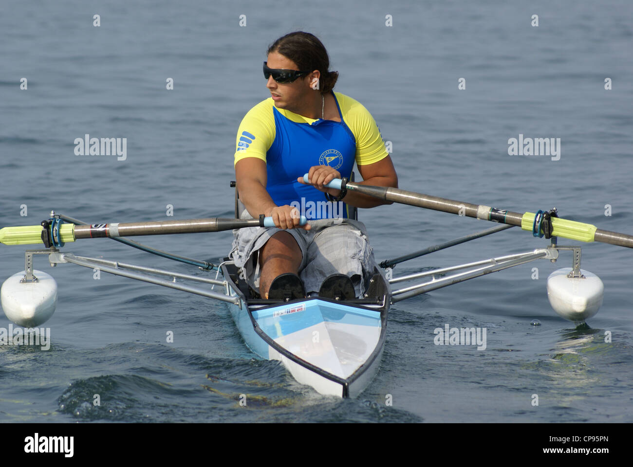 Athlete rowing a boat Stock Photo - Alamy