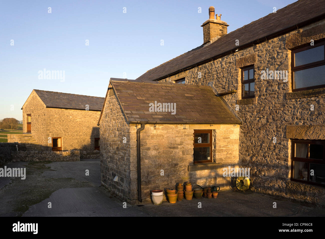 an old stone cottage and farmhouse in a village Stock Photo - Alamy