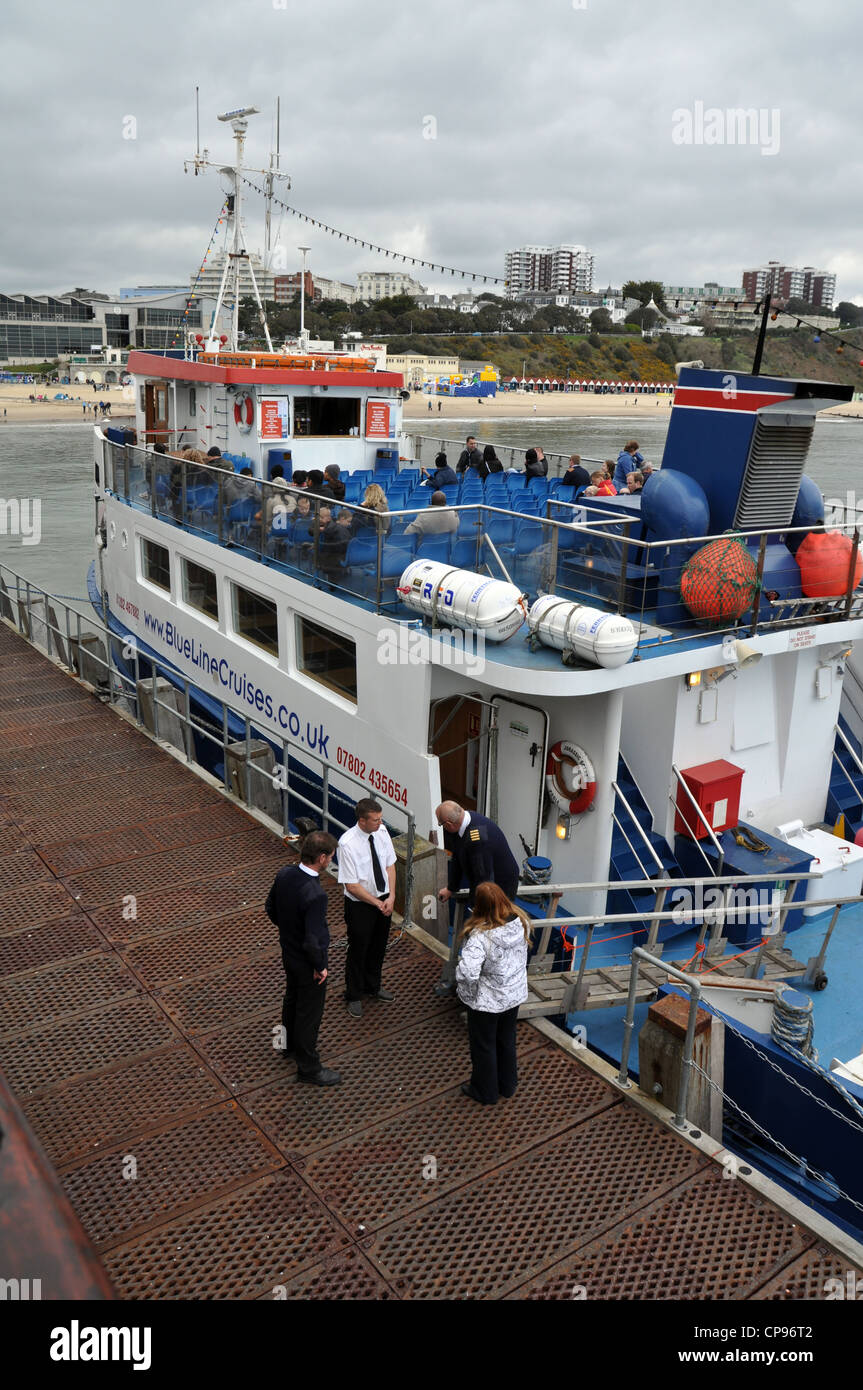 crew getting briefing from their captain before departing on a pleasure ...