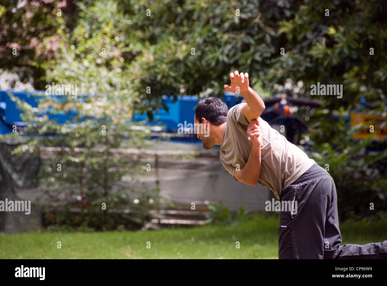 Indian cricketer bowling ball Stock Photo - Alamy