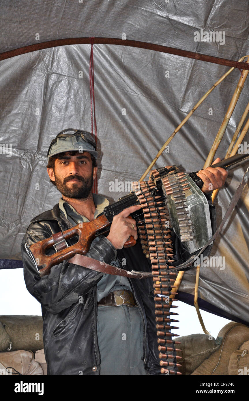 An Afghanistan policeman (named colonel Rambo) shows off his PKM most ...