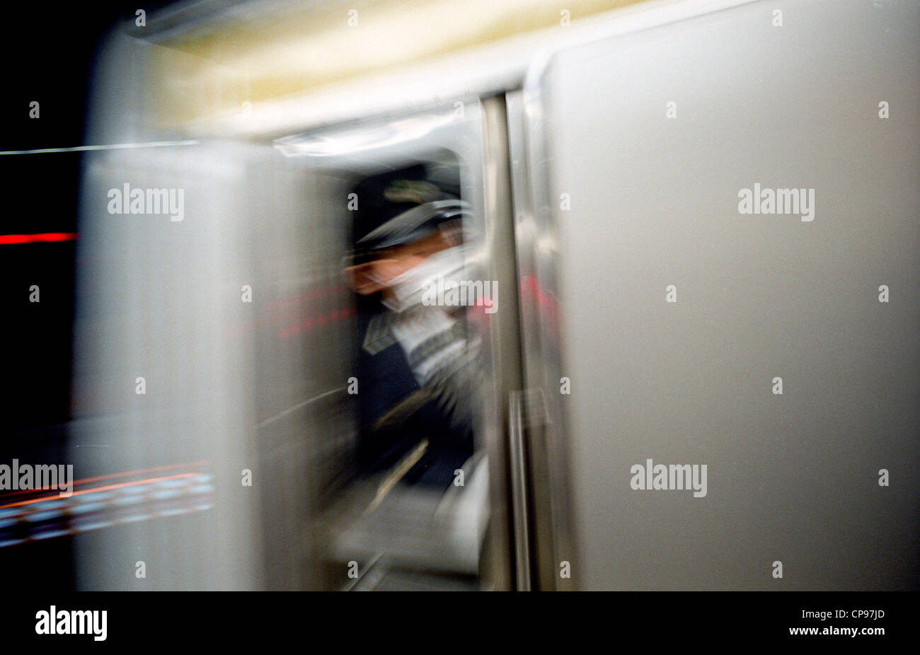 Blurred subway worker in Tokyo metro, Japan Stock Photo - Alamy