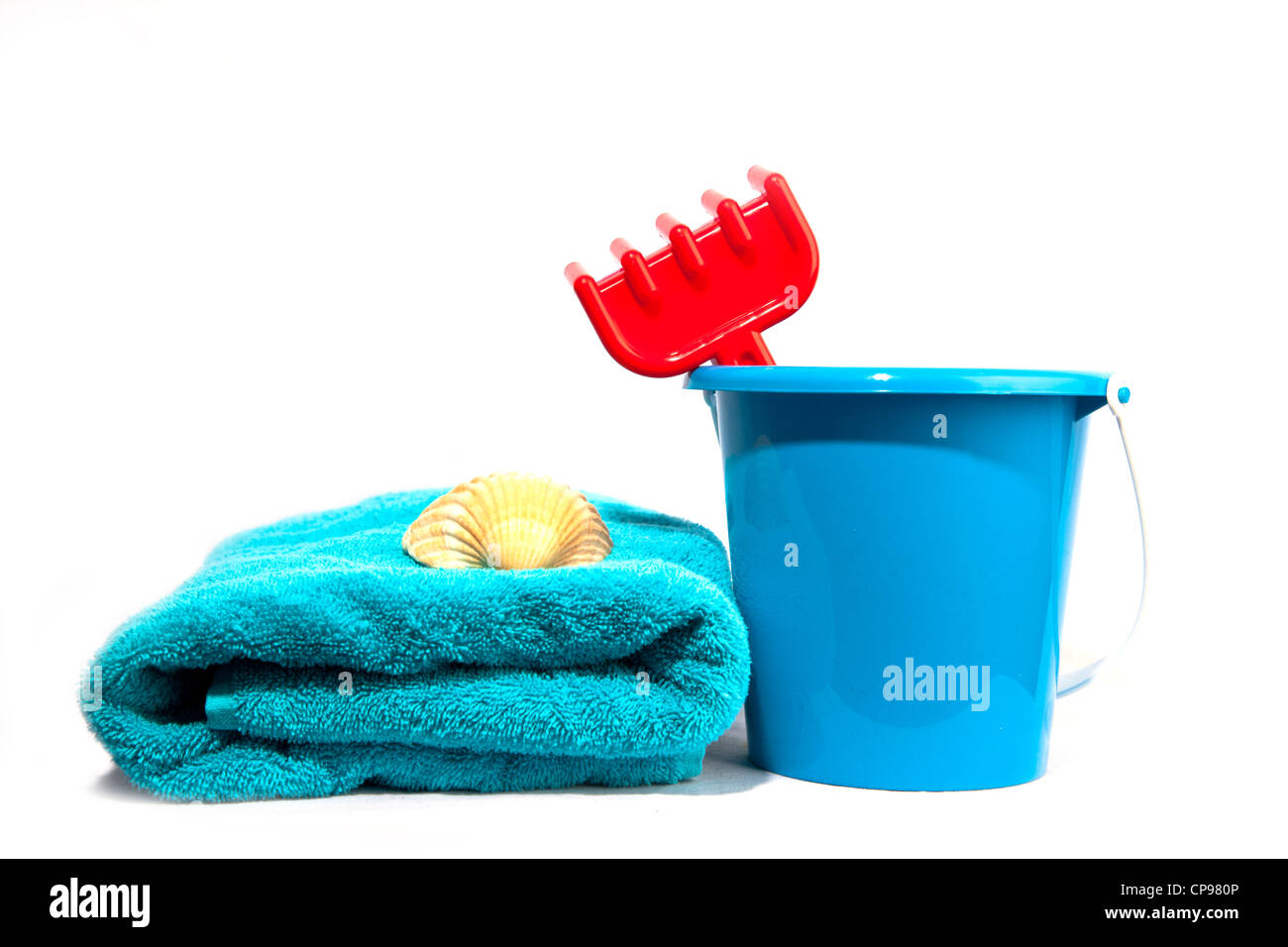 Bucket and towel with shell isolated on white Stock Photo - Alamy