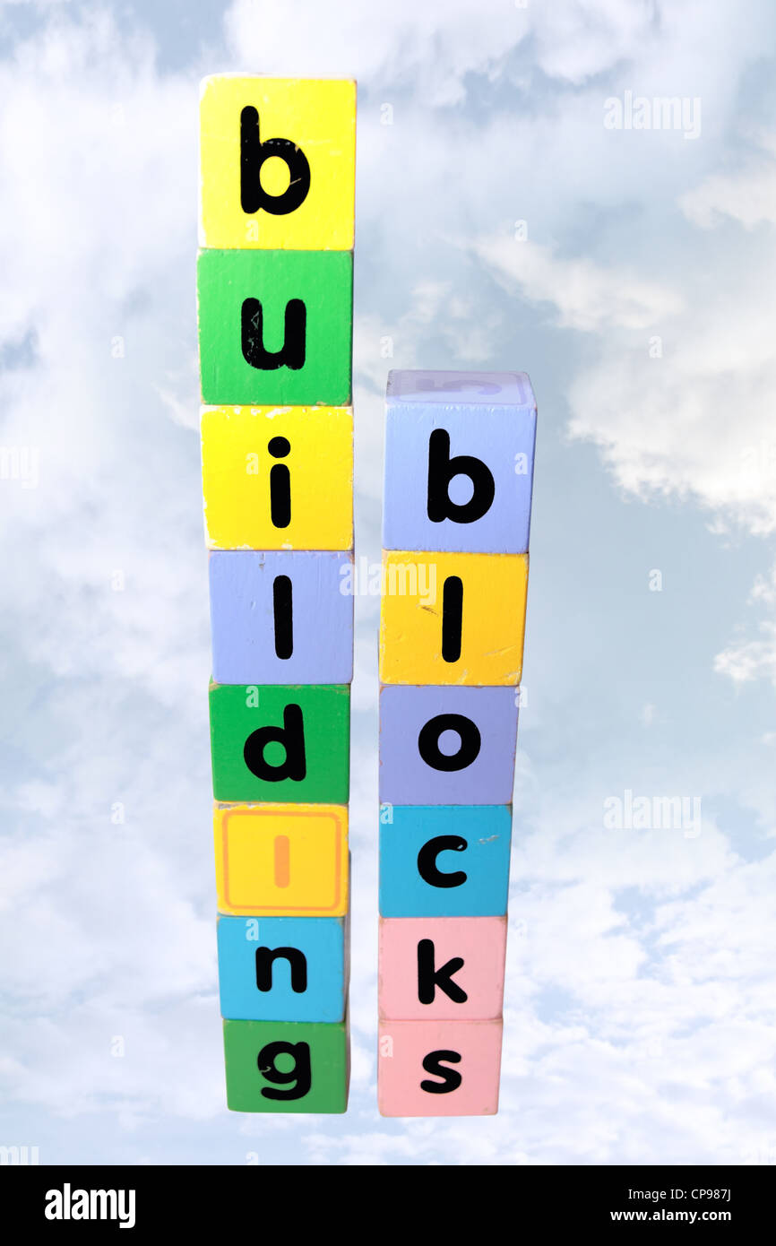 toy letters that spell building blocks with cloudy background and ...
