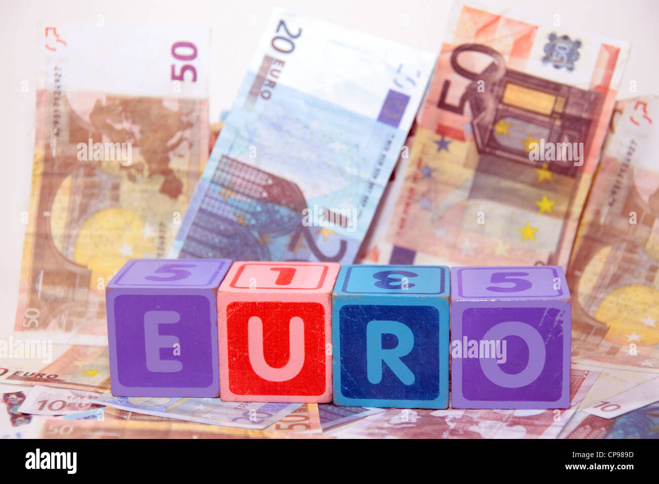 toy letters that spell euro against a cash background Stock Photo - Alamy