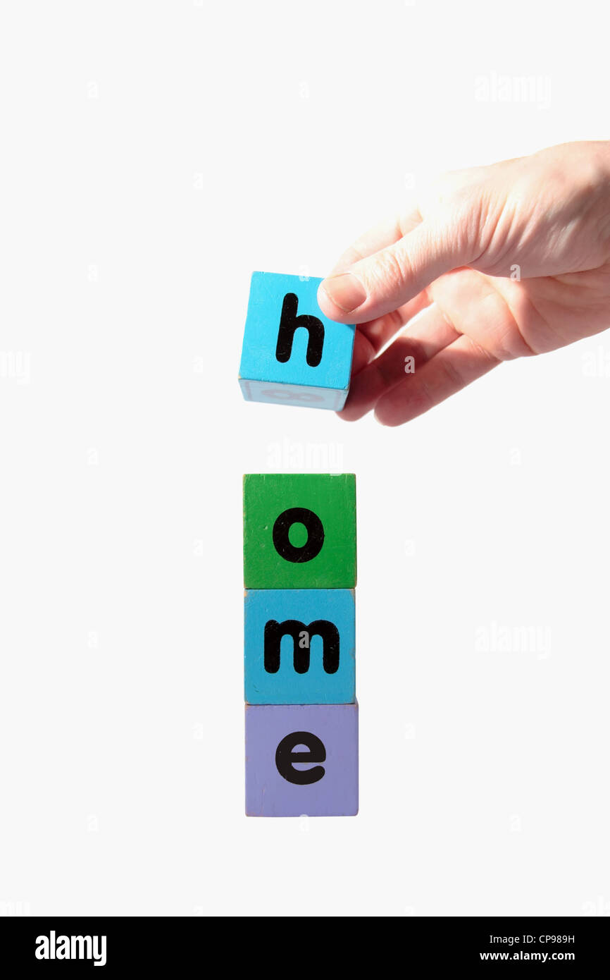 toy letters that spell home against a white background with clipping ...
