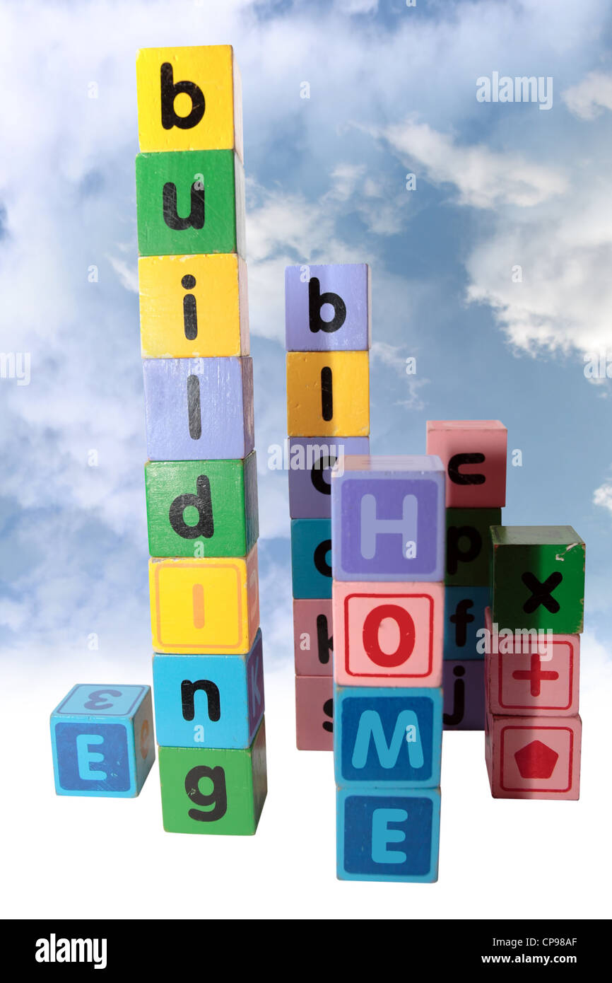 toy letters that spell home building blocks with cloud background and ...