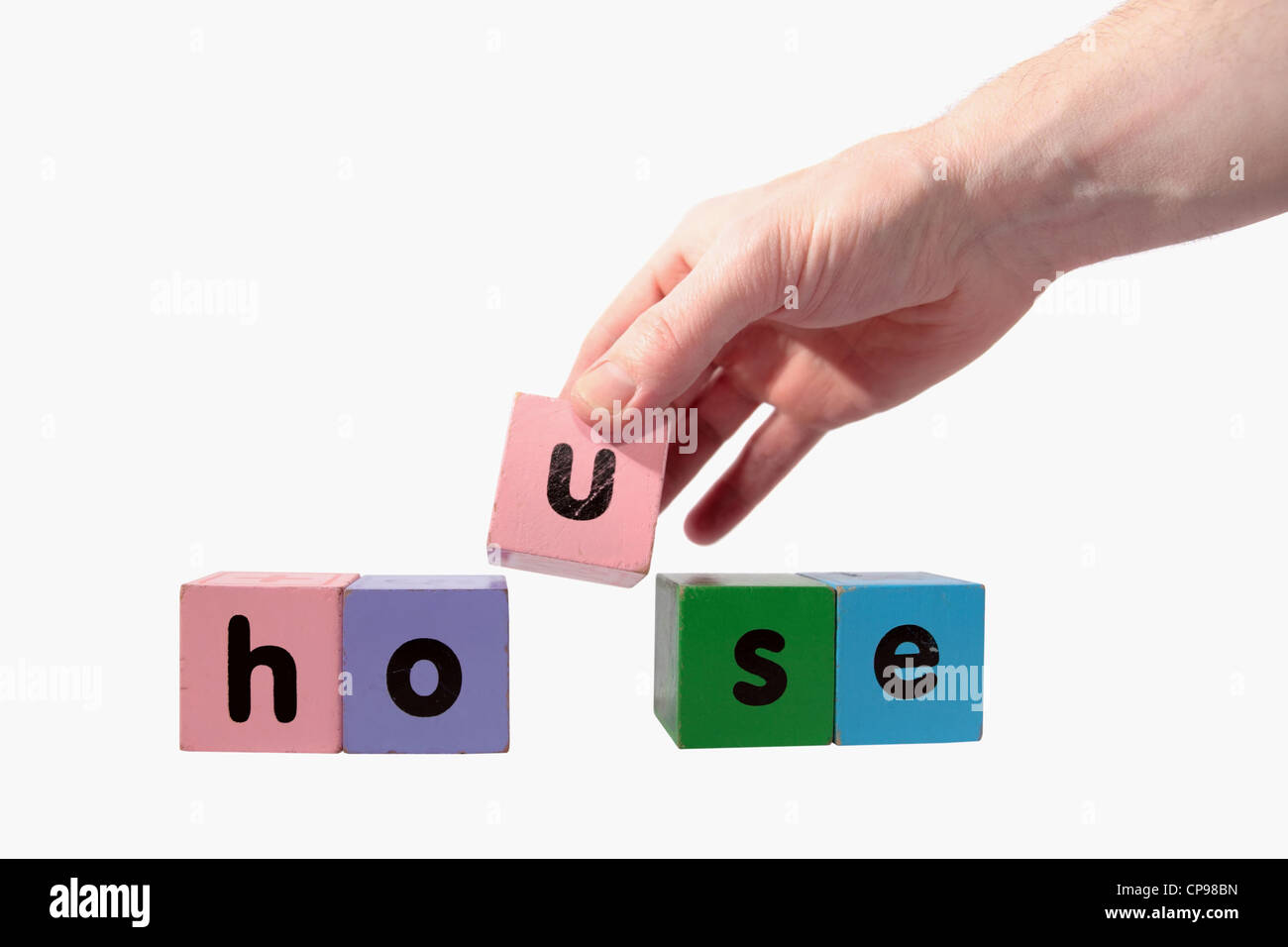 toy letters that spell house against a white background with clipping ...