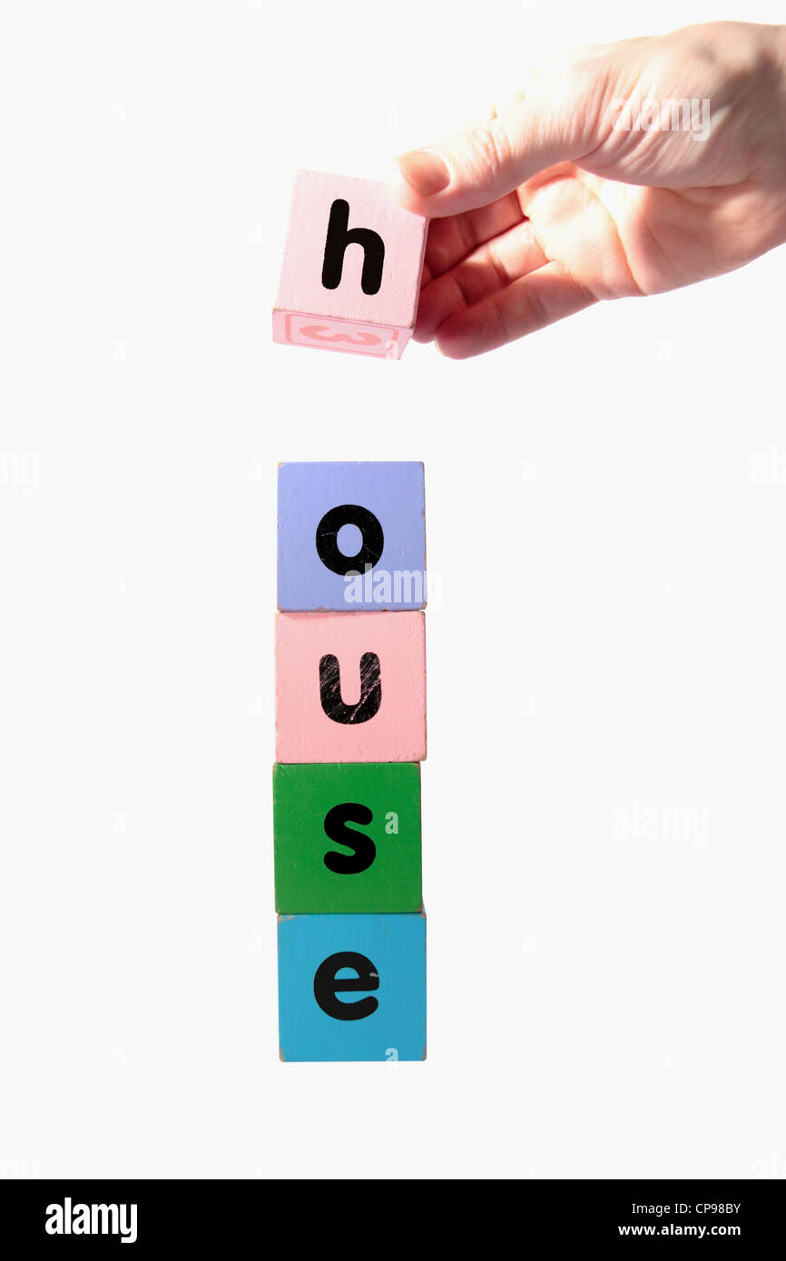 toy letters that spell house against a white background with clipping ...