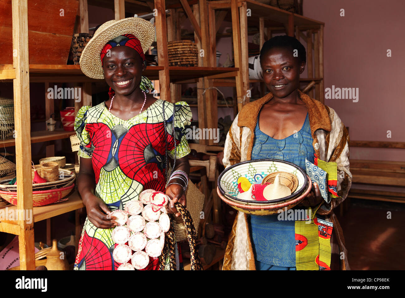 Two Rwandese woman show examples of traditional handicrafts from Rwanda ...