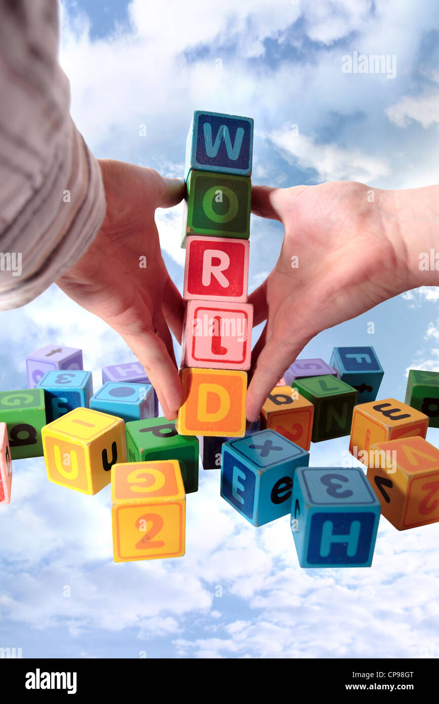 toy letters that spell world in blocks with cloudy background and ...