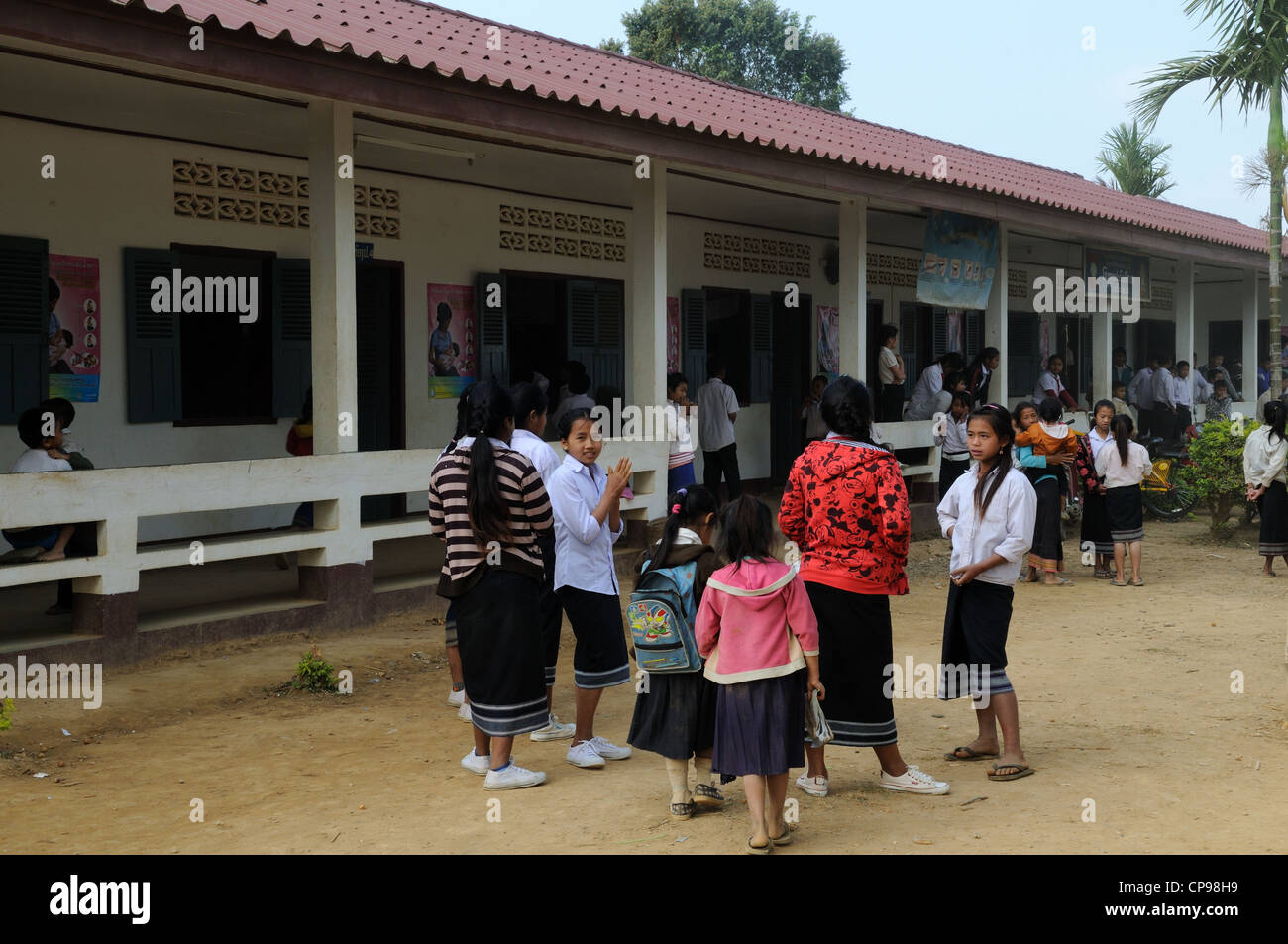 Lao school children during a presentation of books and stationary by ...