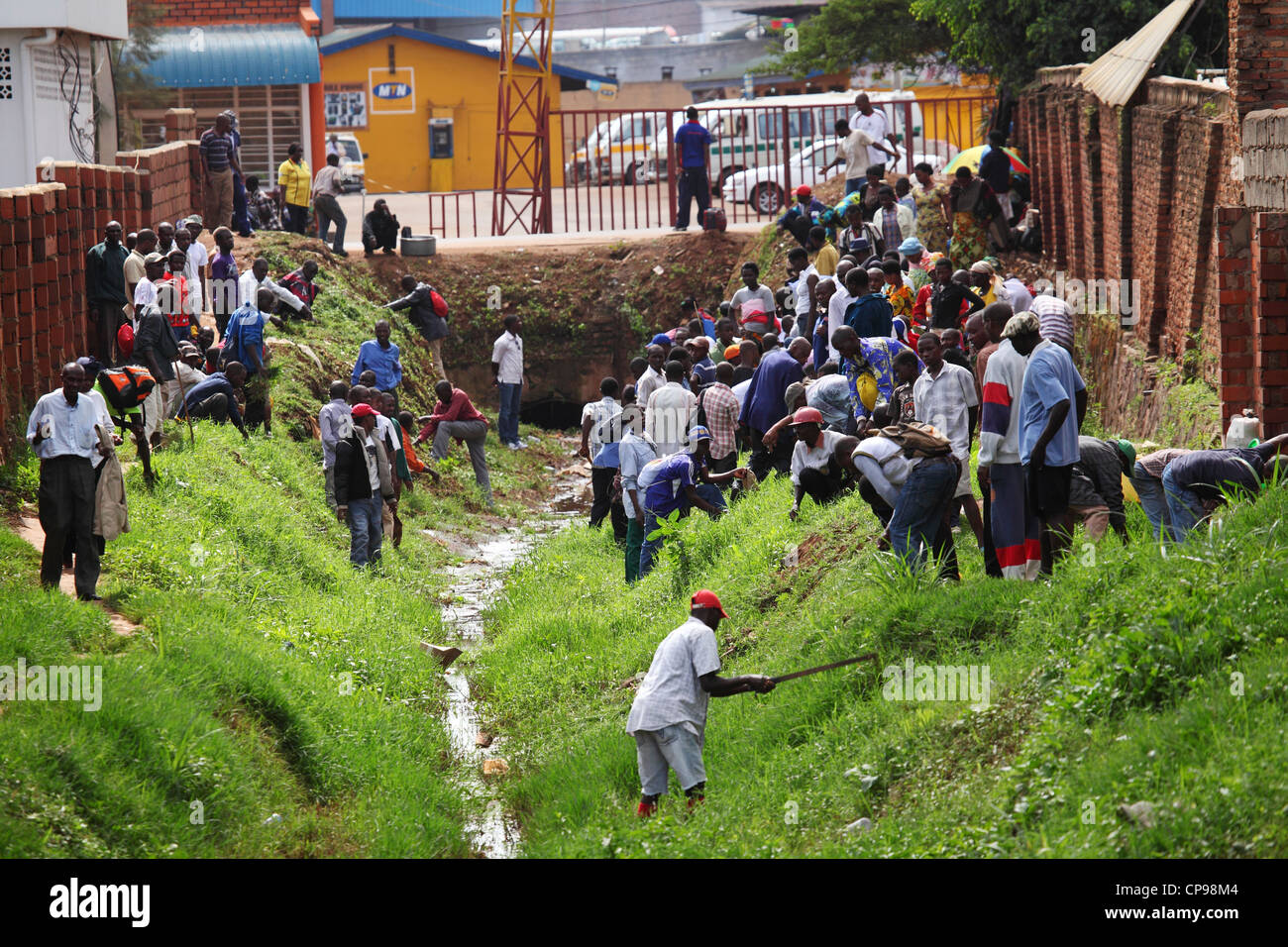 Rwandese people participate in the national clean-up day, Umuganda, in ...