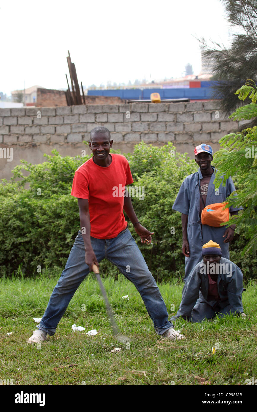 Rwandese men participate in the national clean-up day, Umuganda, in ...