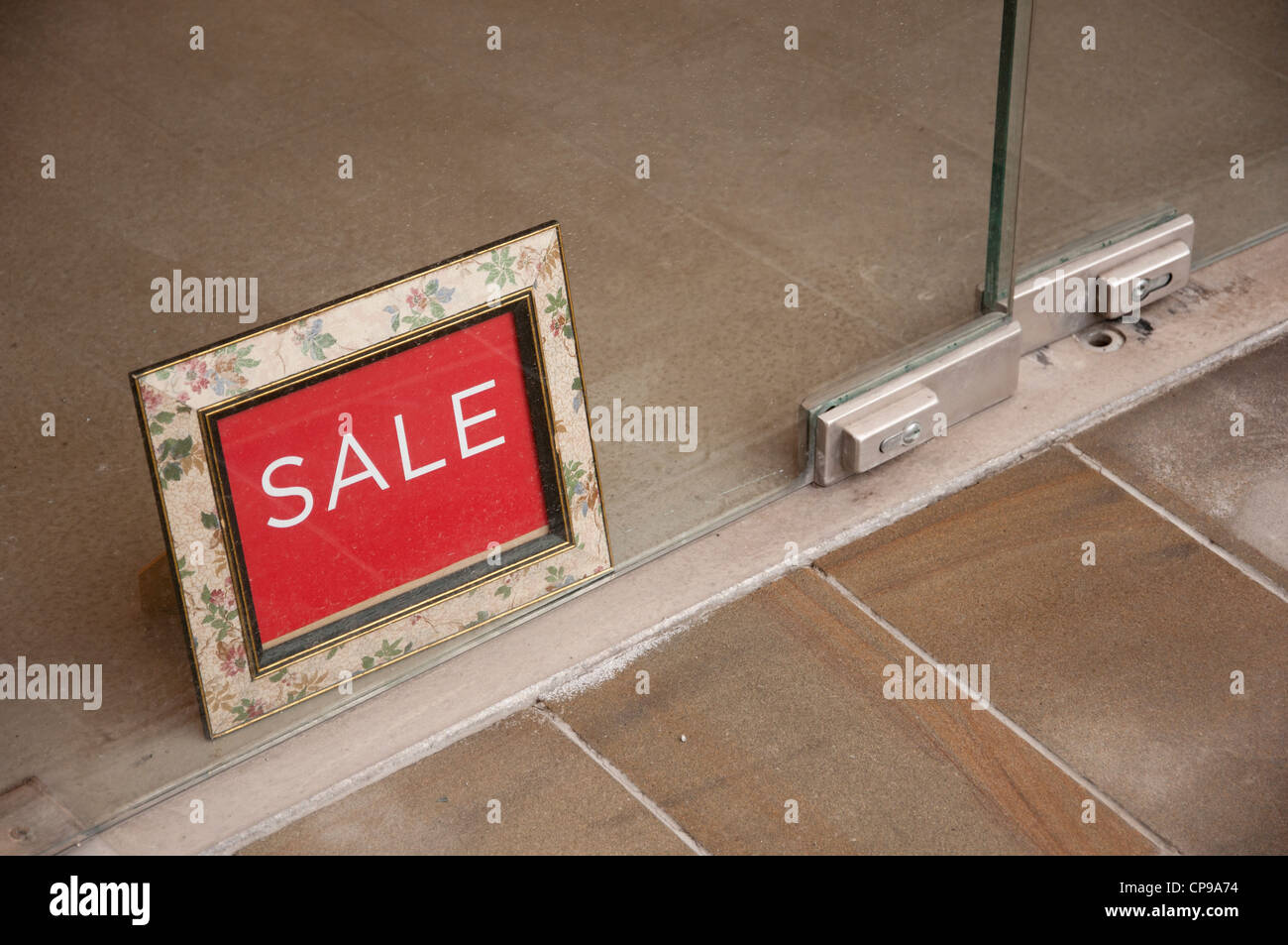 Sale sign in shop doorway Stock Photo - Alamy