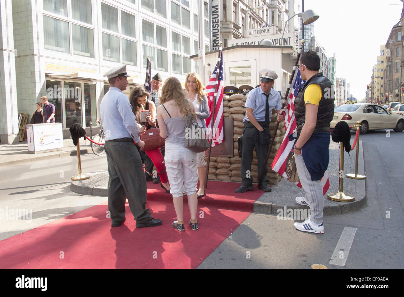 Checkpoint Charlie at Friedrichstrasse - Berlin Wall with female ...