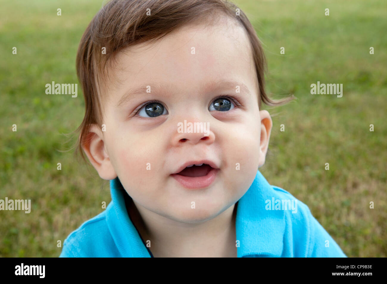 Smiling Young Boy Looking Up, Close-Up Stock Photo - Alamy