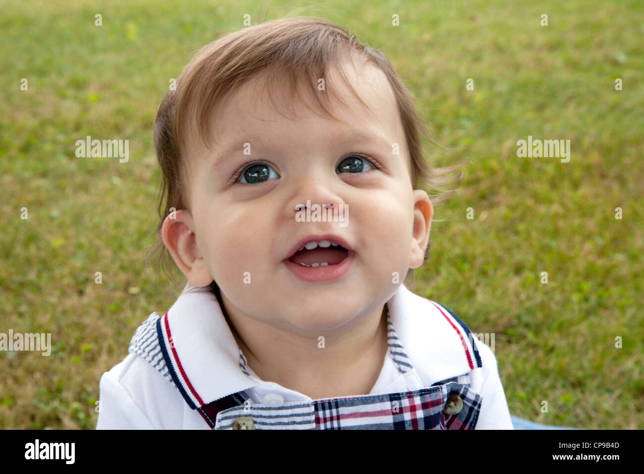Smiling Young Boy Looking Up, Close-Up Stock Photo - Alamy