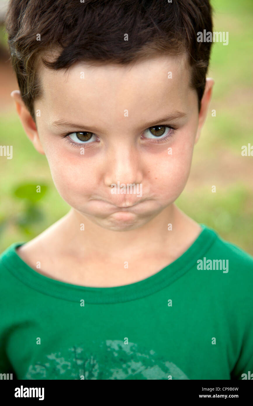 Young Boy Making Funny Face With Cheeks and Mouth Stock Photo - Alamy