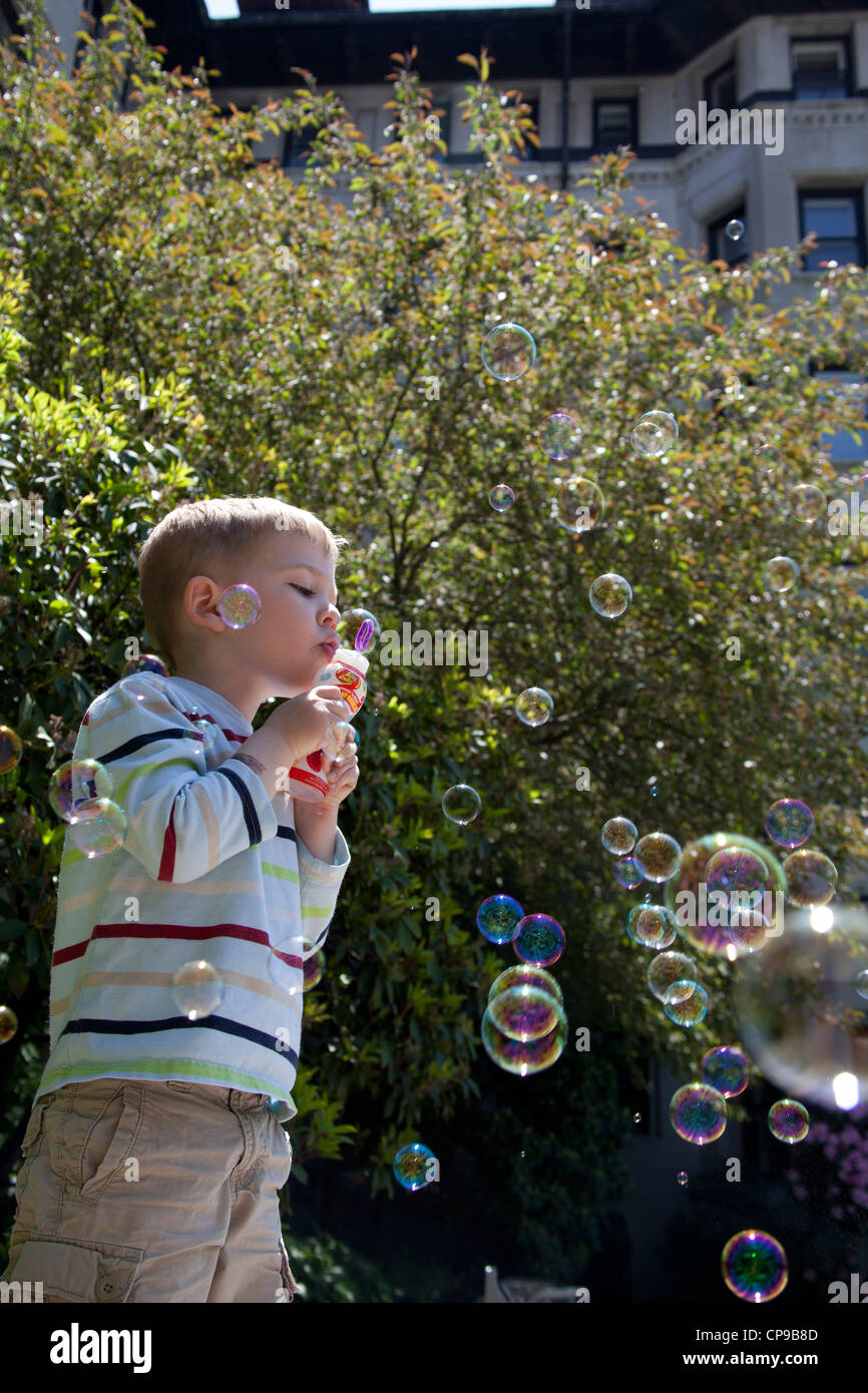 Young Boy Blowing Bubbles Stock Photo - Alamy